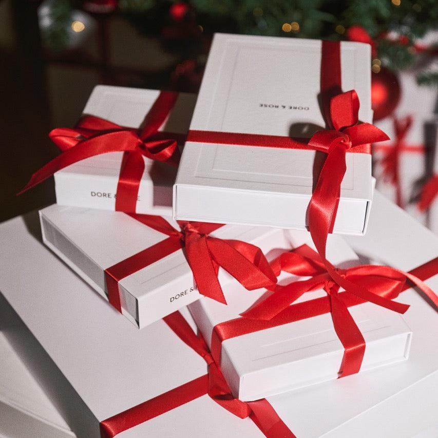 Stack of Dore and Rose boxes in Christmas packaging
